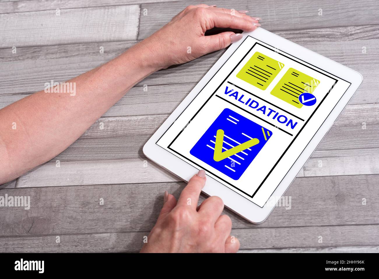 Validation concept shown on a tablet used by a woman Stock Photo - Alamy