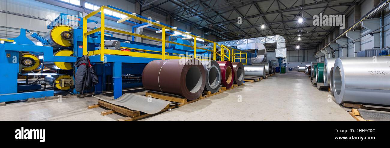 Panoramic photo shot. Production line of metal tile for roof. Steel ...