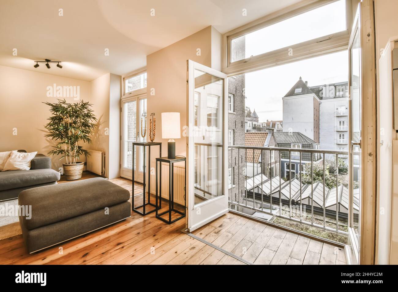 A luxurious living room with an open door leading to the balcony Stock ...