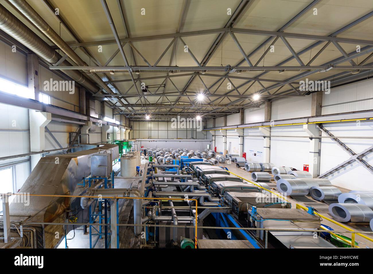 Photo of production line of metal tile for roof. Steel forming machine ...