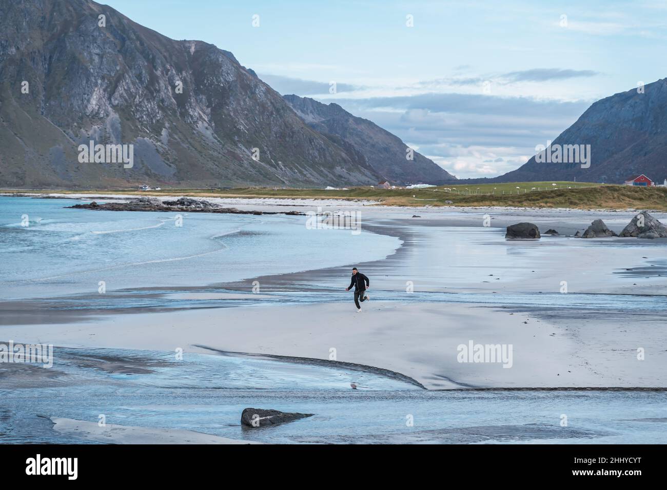 Man running on a Norwegian beach Stock Photo - Alamy