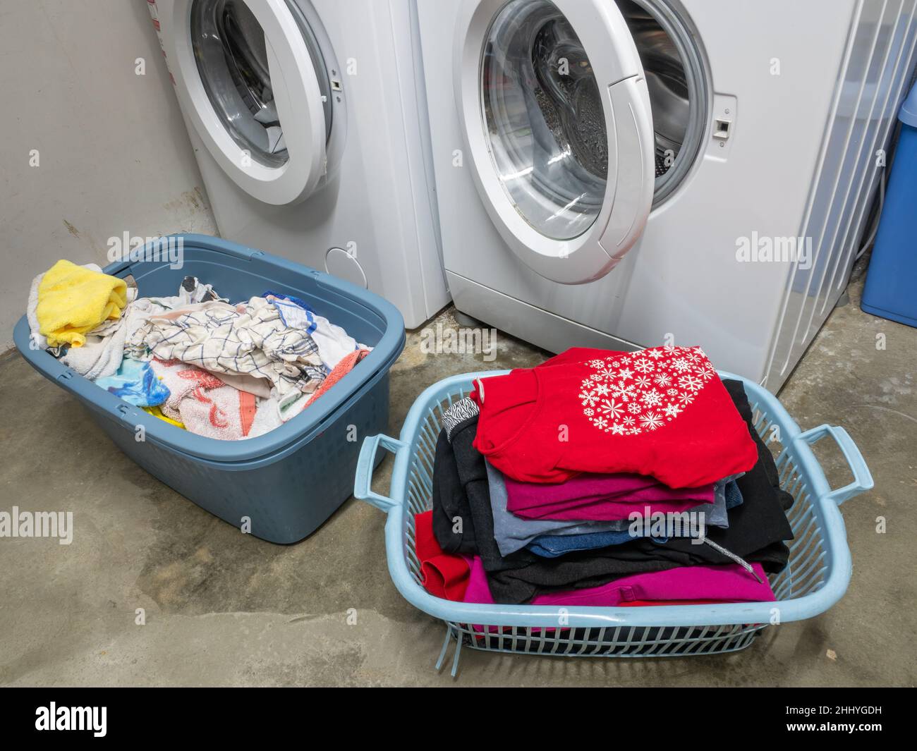 Washing machine in laundry room with laundry baskets Stock Photo - Alamy