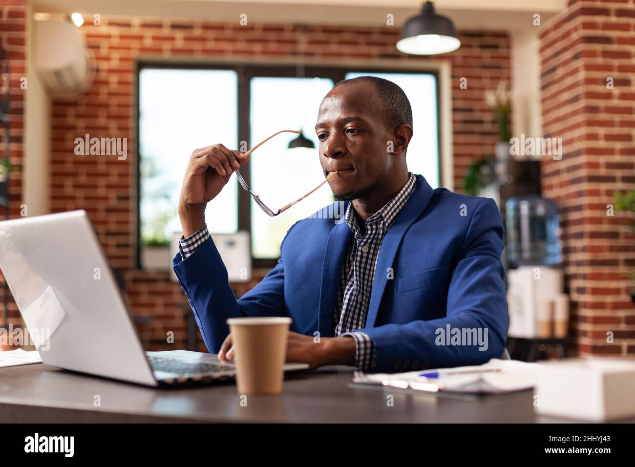 Business man brainstorming ideas and working with laptop on project ...