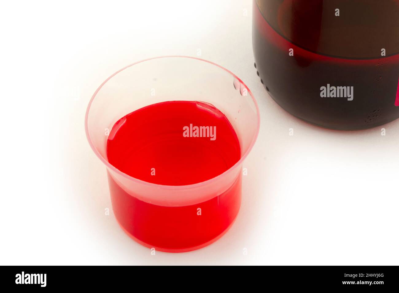 cough syrup in measuring cup Stock Photo - Alamy