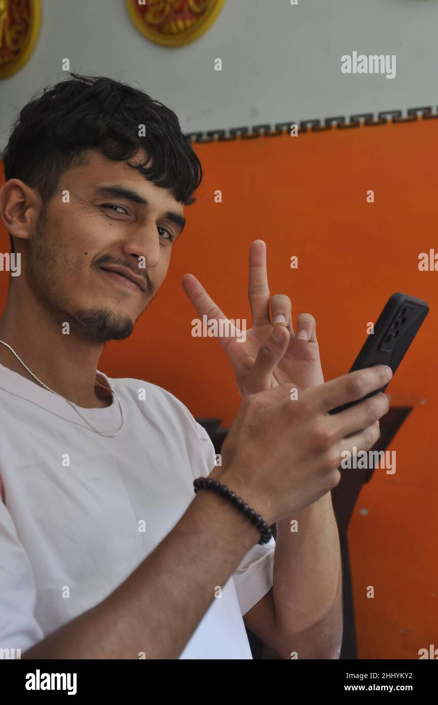 Indian man looking at sign hi-res stock photography and images - Alamy