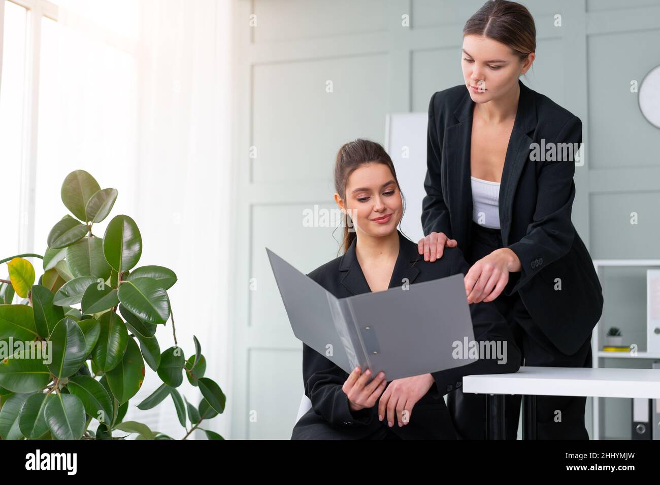 Young women leaders are checking financial statements from paper ...