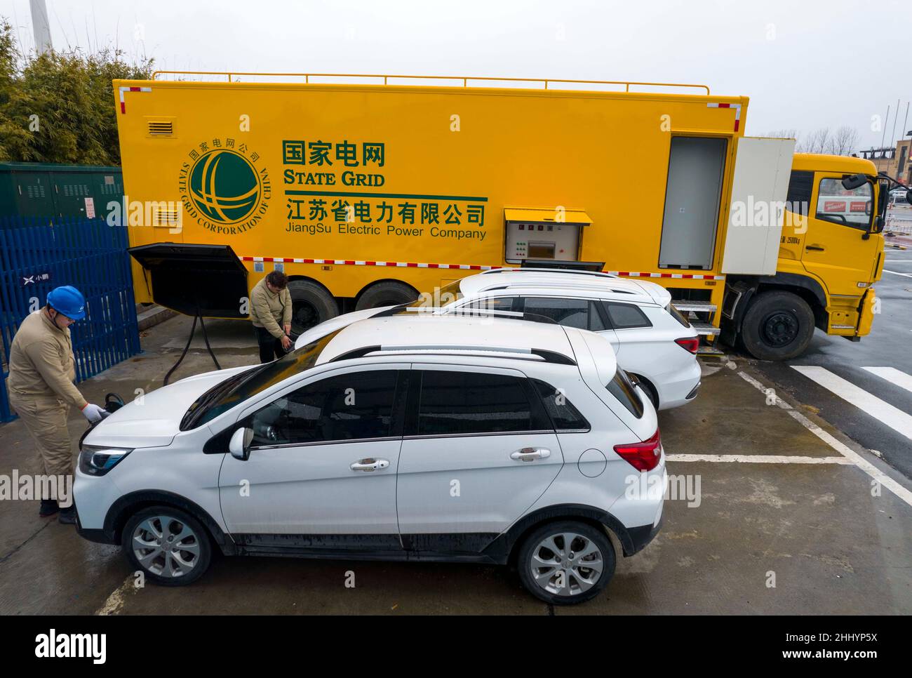 TAIZHOU, CHINA - JANUARY 26, 2022 - A car owner charges an electric car ...