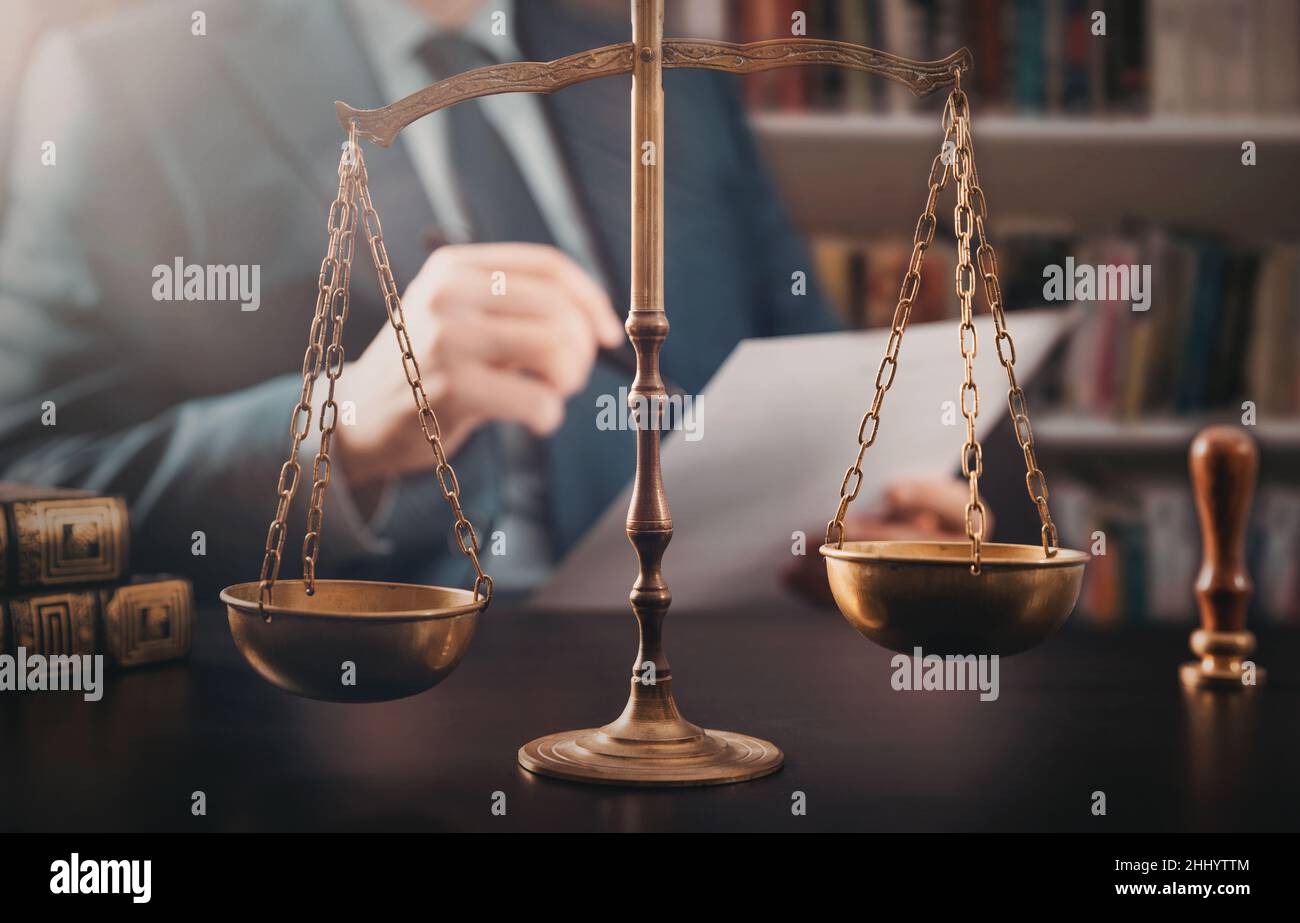 Lawyer working in the office. Law concept with weight scale Stock Photo ...