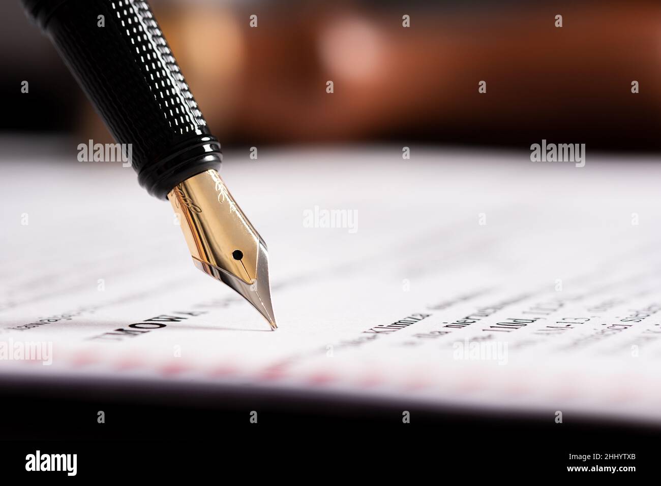 Law, notary background theme. Fountain pen and handmade paper on desk ...