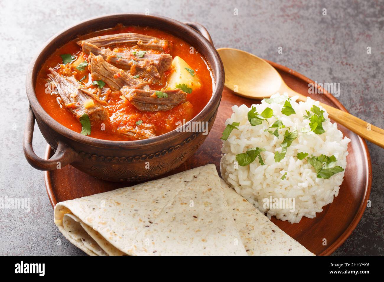 Hilachas is a staple of Guatemalan cuisine, a red colored stew ...