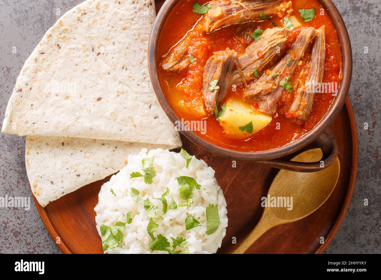 Hilachas is a staple of Guatemalan cuisine, a red colored stew ...