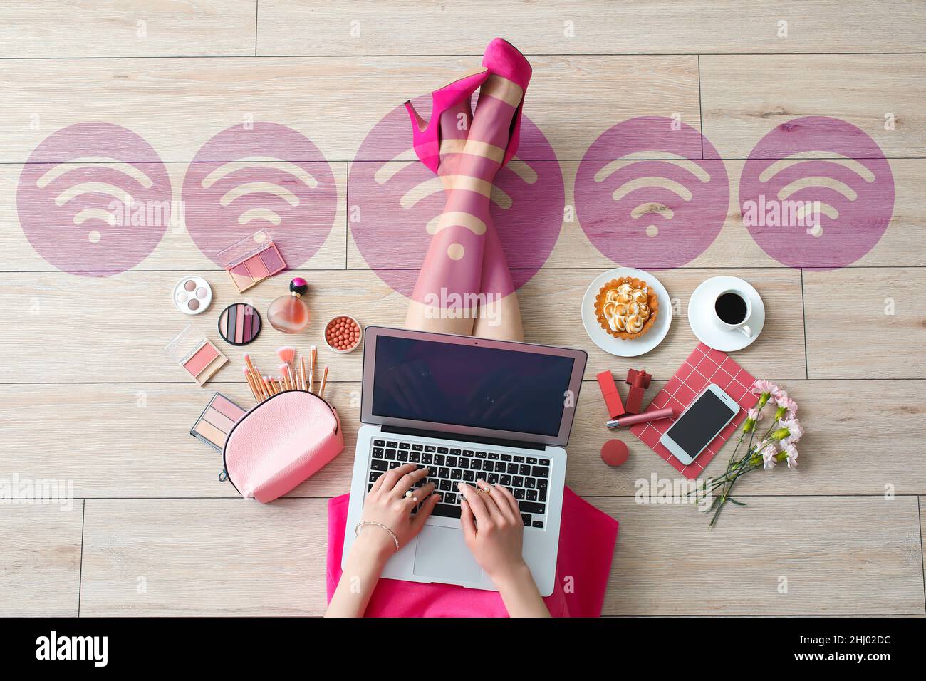 Female makeup artist with laptop using wi-fi at home, top view Stock ...