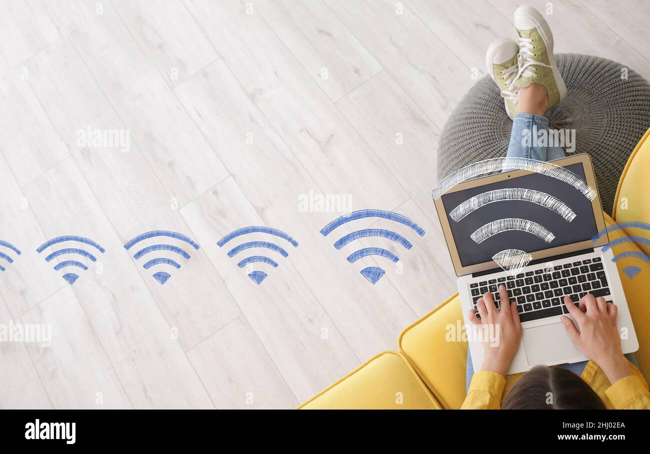 Young woman with laptop using wi-fi at home, top view Stock Photo - Alamy