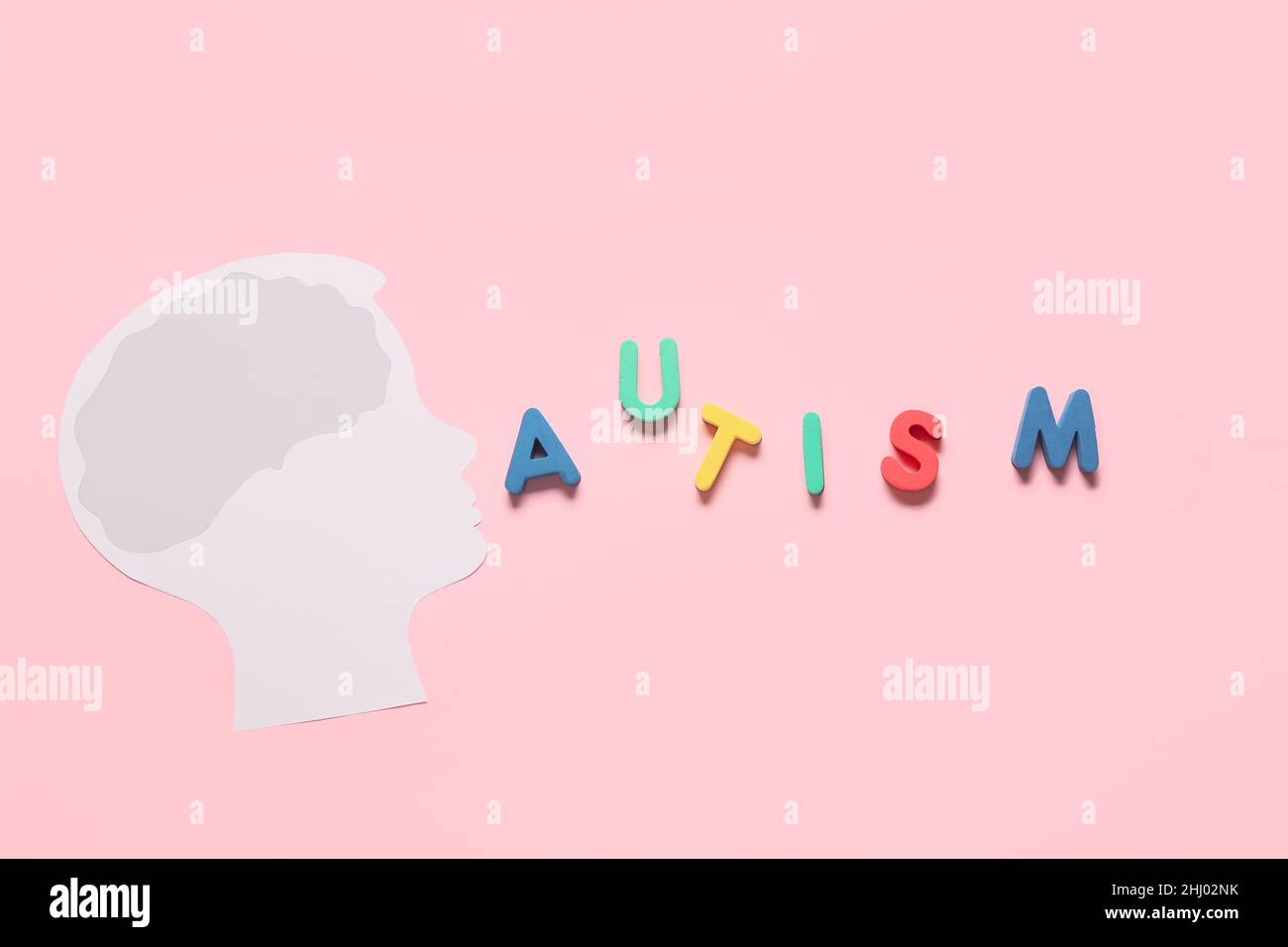 Paper human head with word AUTISM on color background. Concept of ...