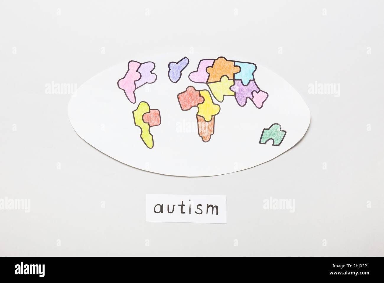 Drawn world map and word AUTISM on light background Stock Photo - Alamy
