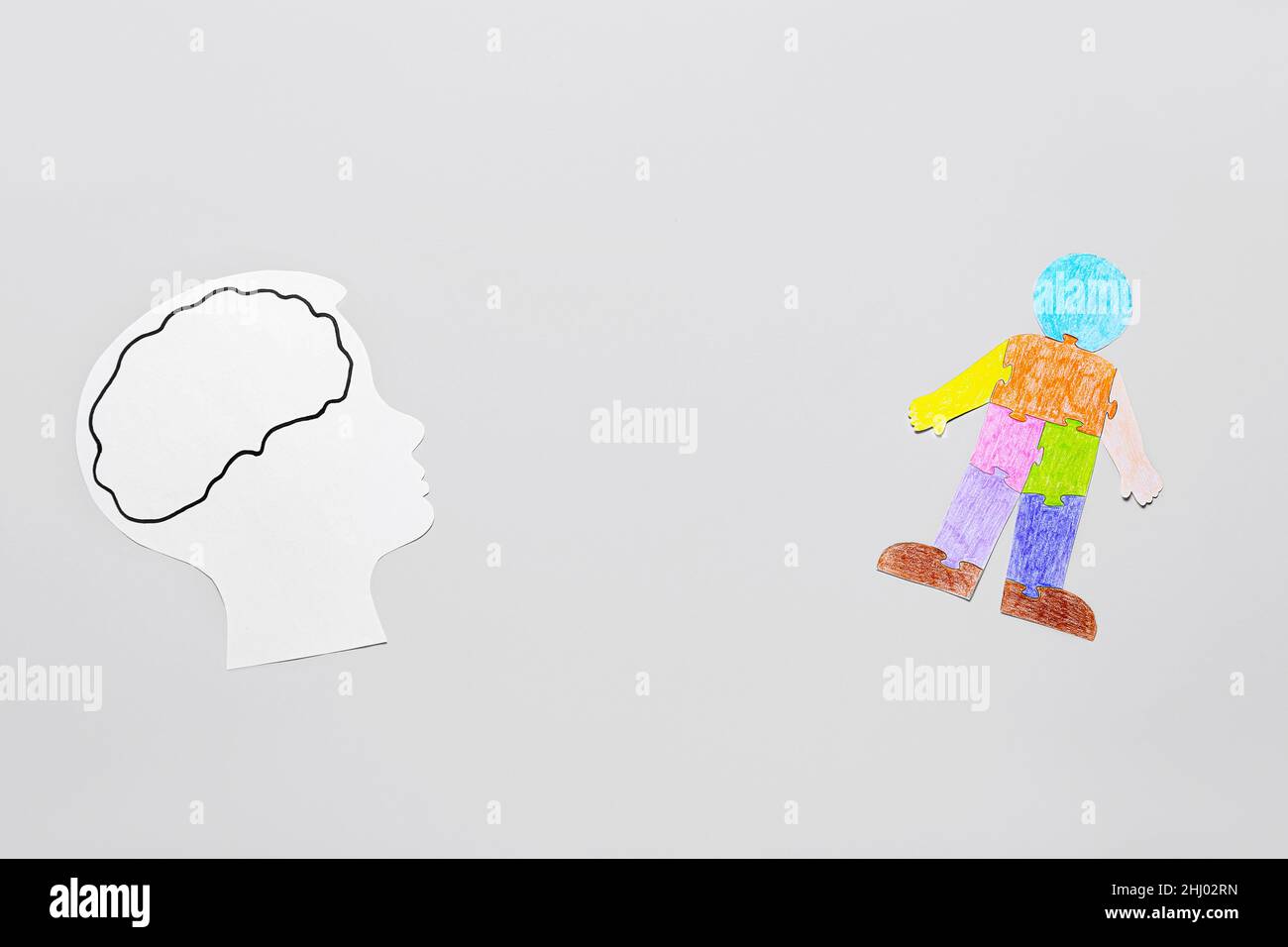 Paper head and colorful human figure on light background. Concept of ...
