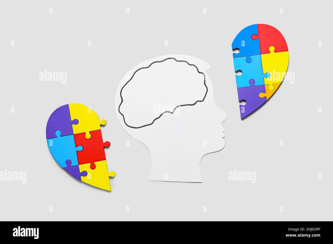 Paper human head with colorful puzzle pieces on light background ...