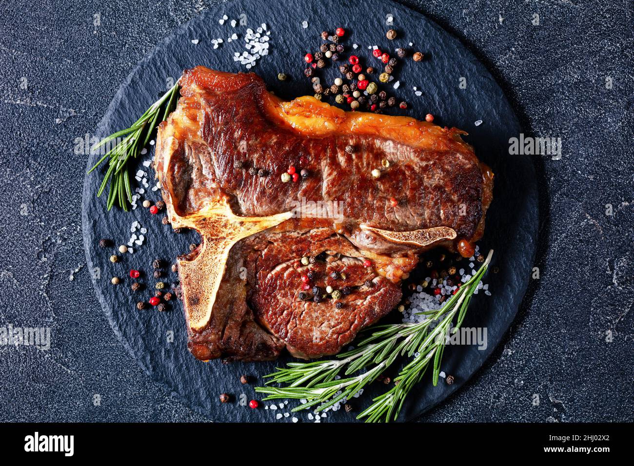fried porterhouse steak, t-bone steak with thyme, rosemary and ...