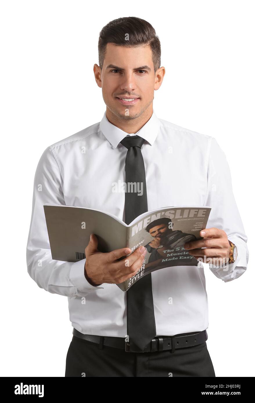 Handsome man in formal clothes holding magazine on white background ...
