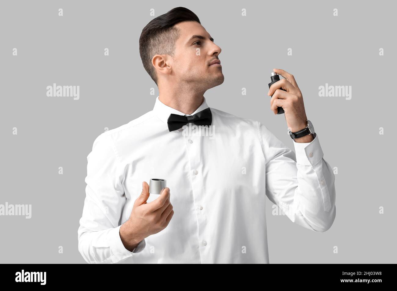 Man spraying perfume hi-res stock photography and images - Alamy