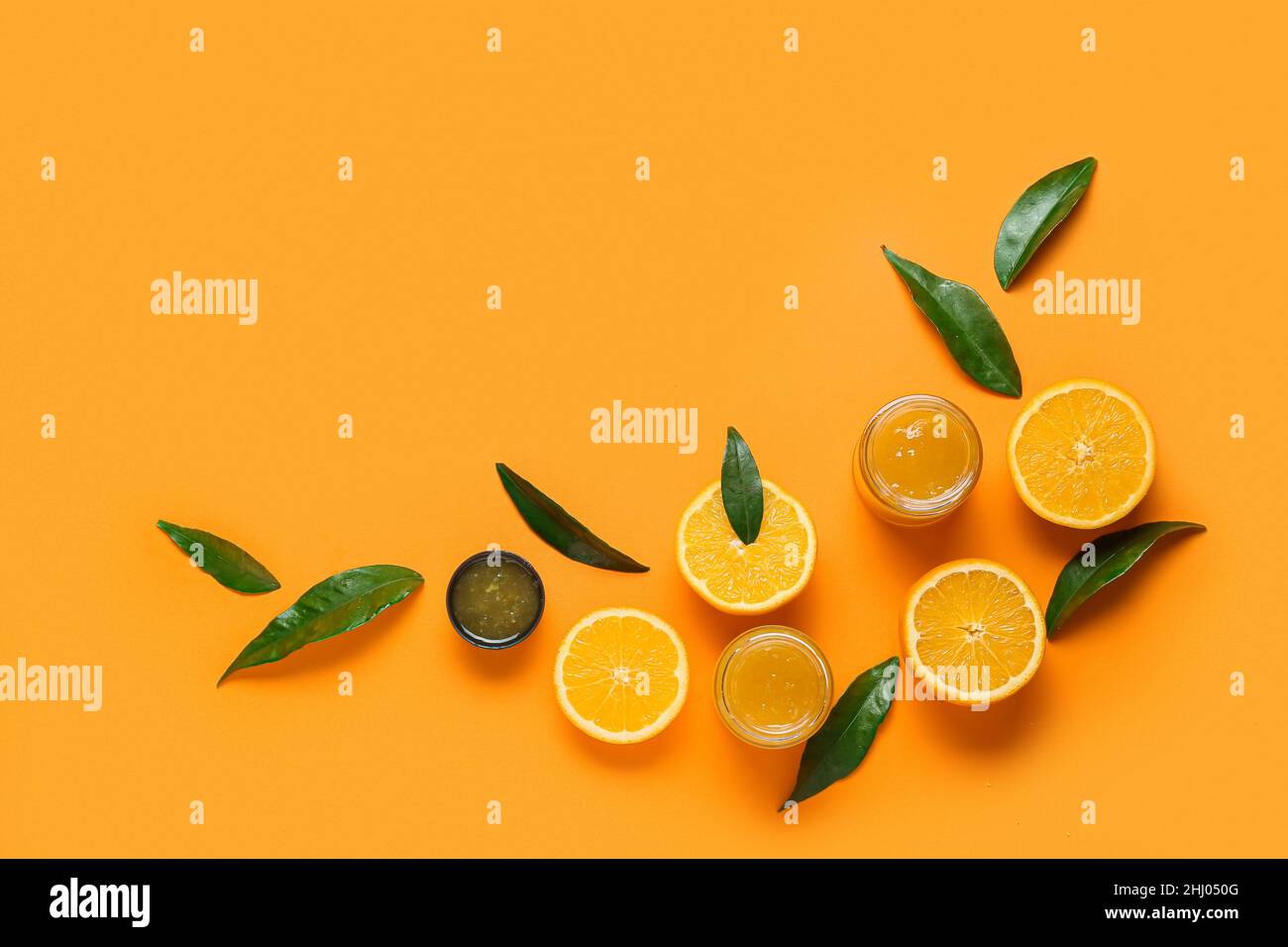 Composition with tasty orange jam on color background Stock Photo - Alamy