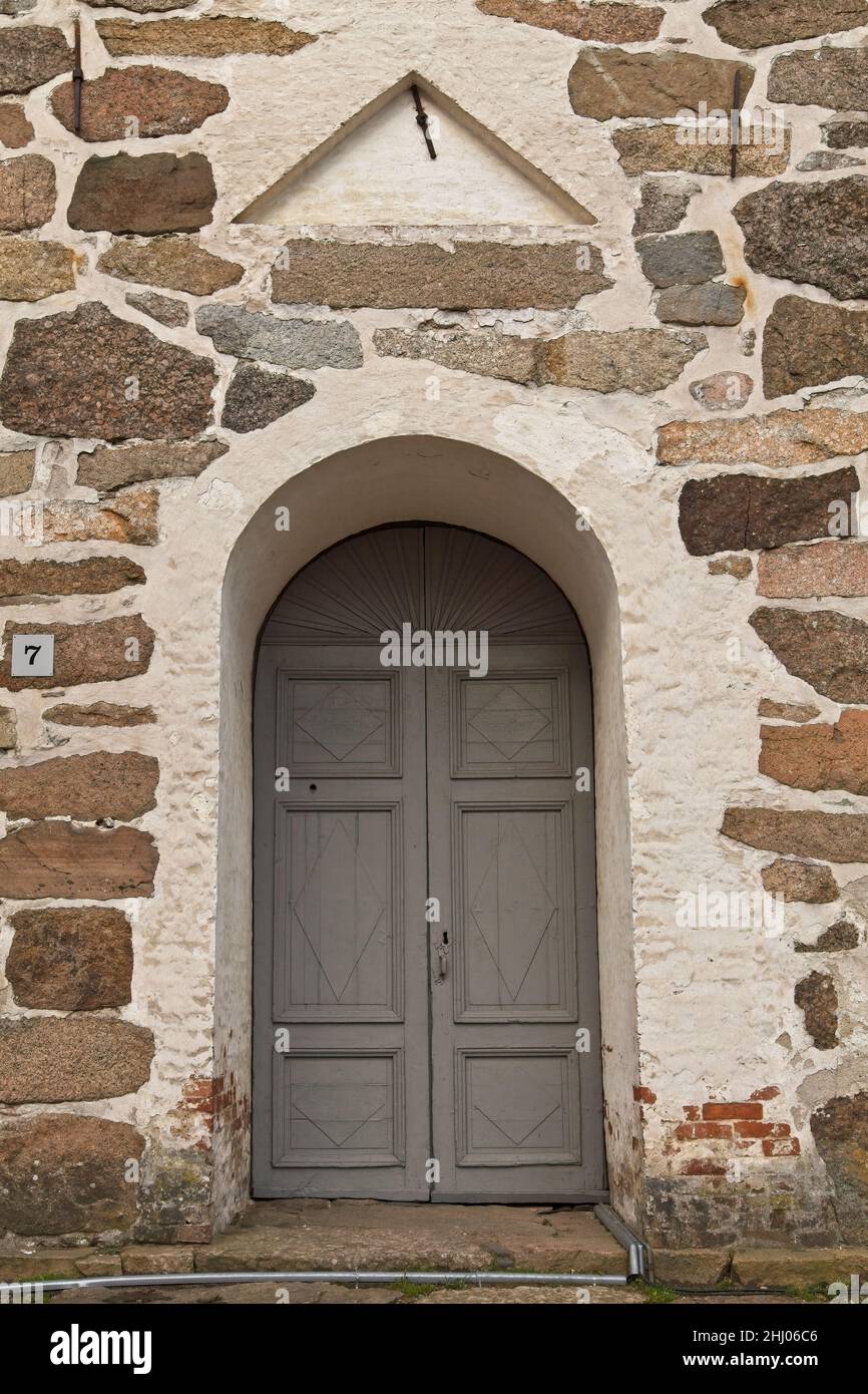Wooden door on a stone building Stock Photo - Alamy