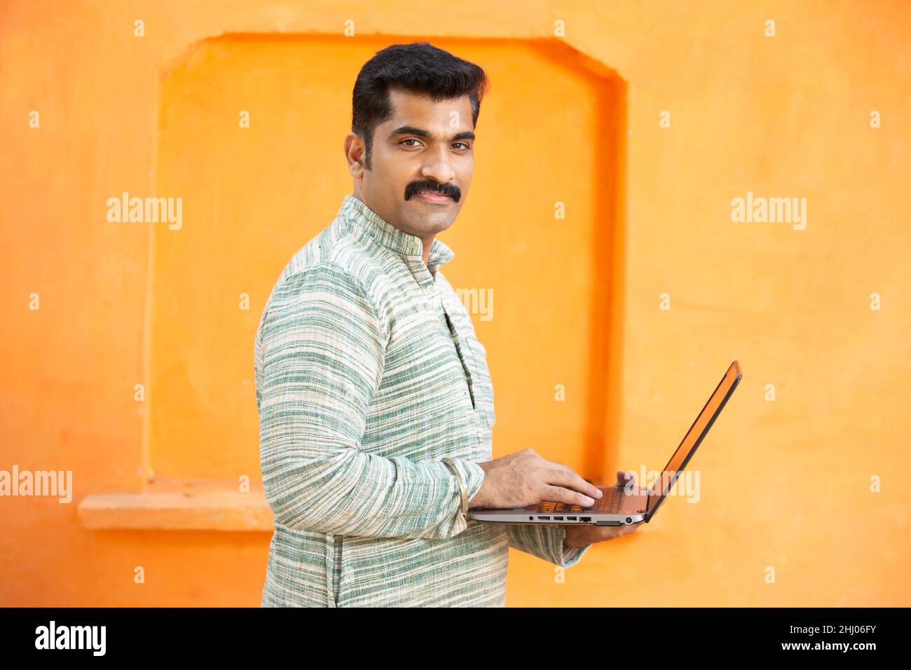 Portrait of Happy rural indian man using laptop . mustache male wearing ...