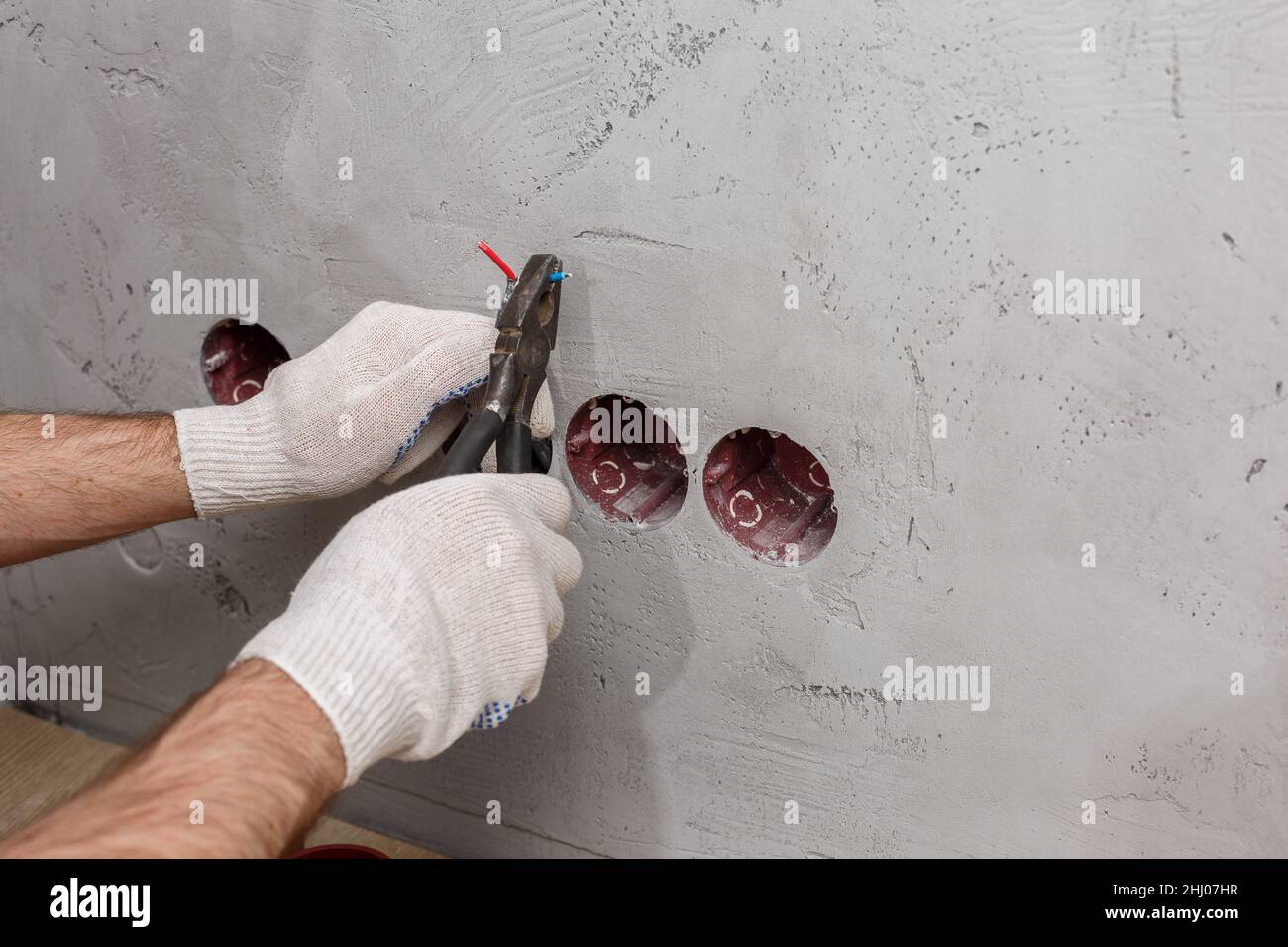 Electrician installs wiring in hi-res stock photography and images - Alamy