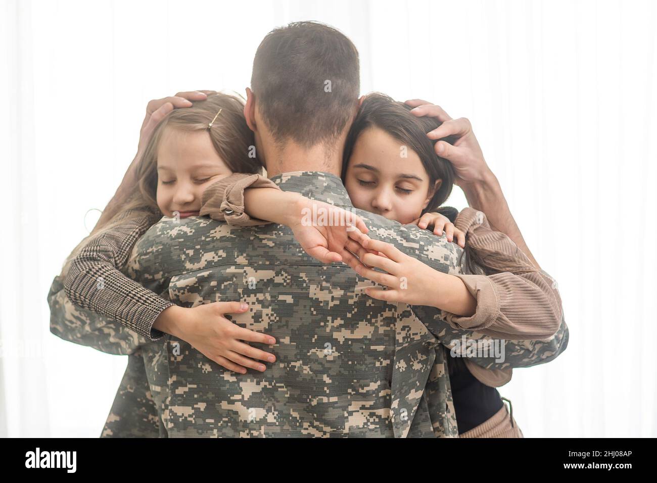 military father and two daughters at home Stock Photo - Alamy
