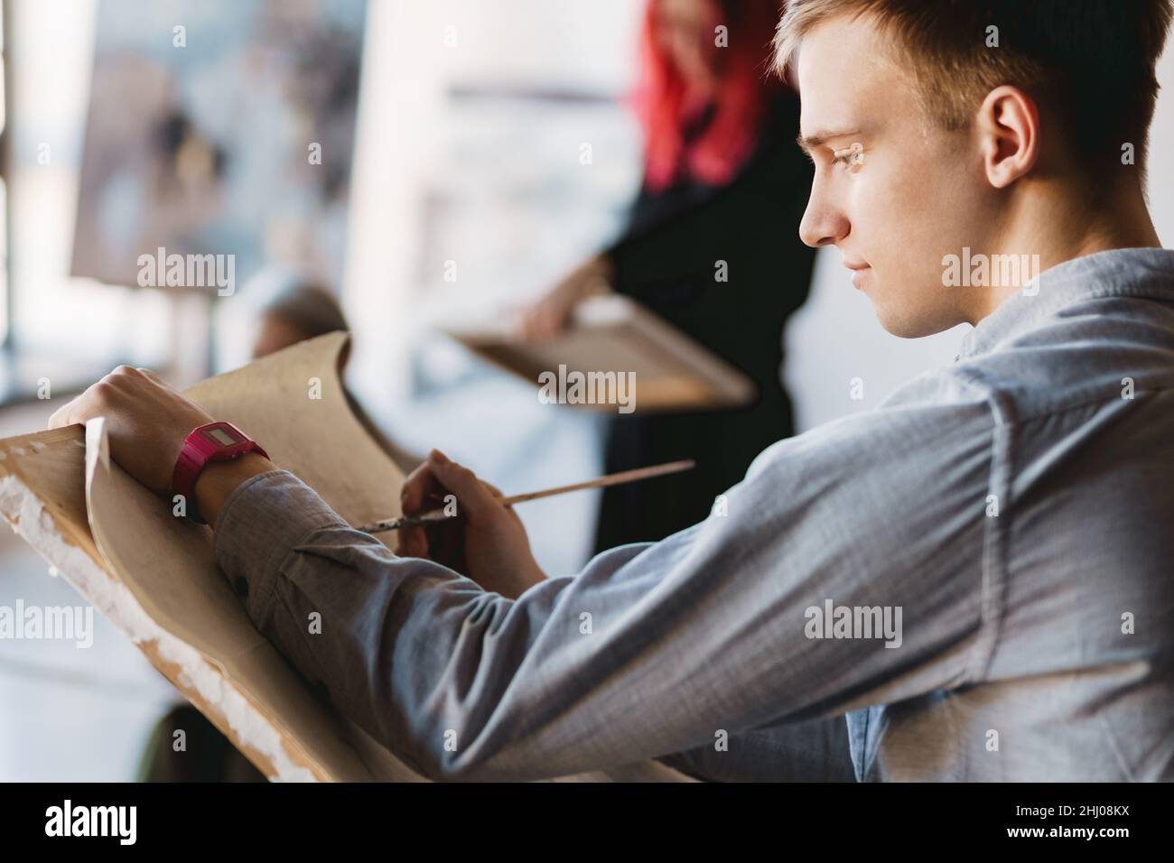 Young white students drawing during class in art school indoors Stock ...