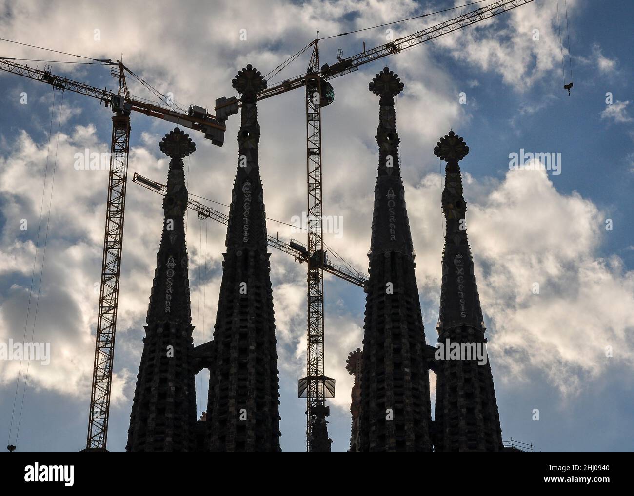 Towers of the Nativity façade of the Sagrada Familia basilica on an ...