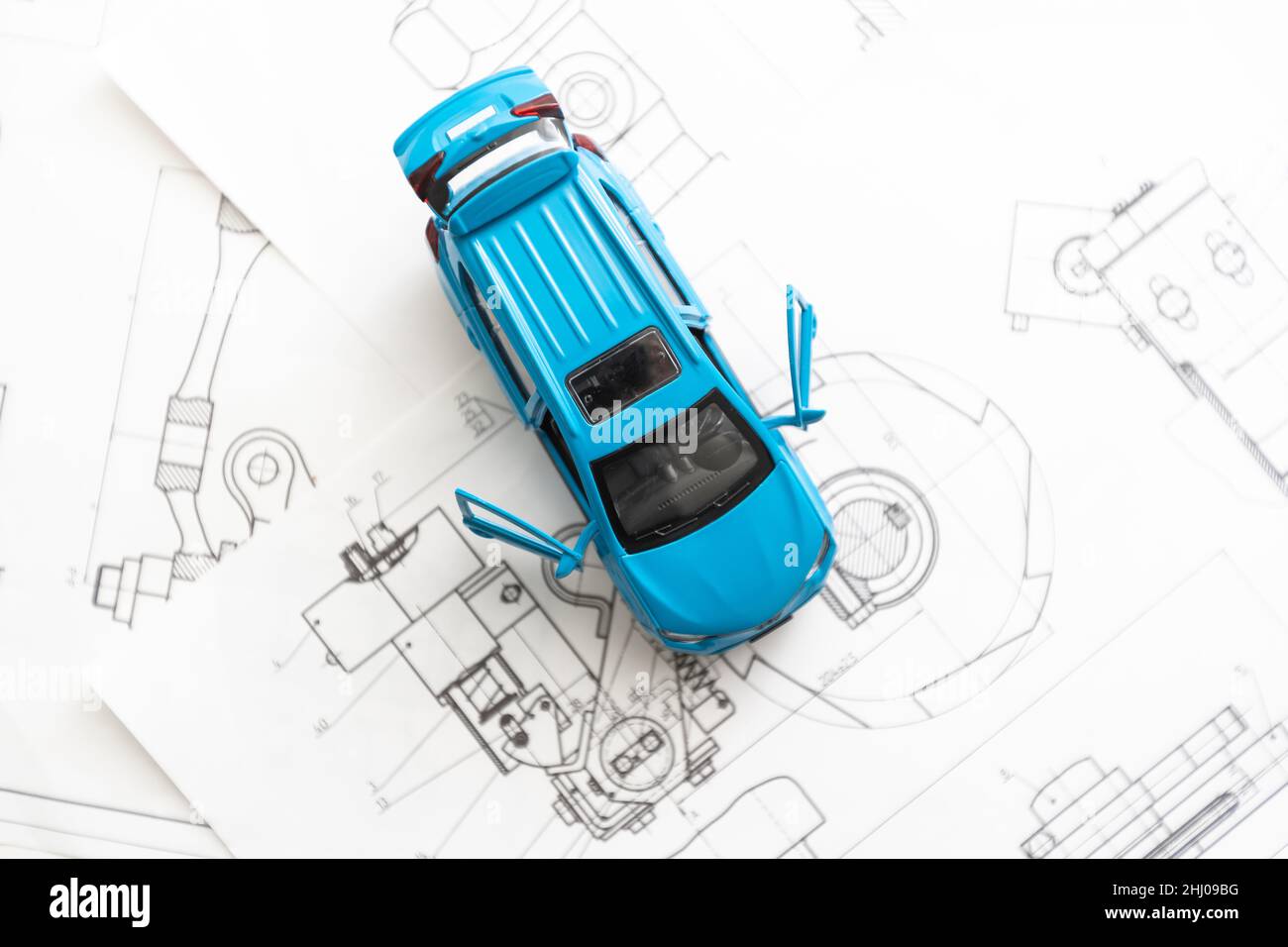 small car model and blueprint sheets Stock Photo - Alamy