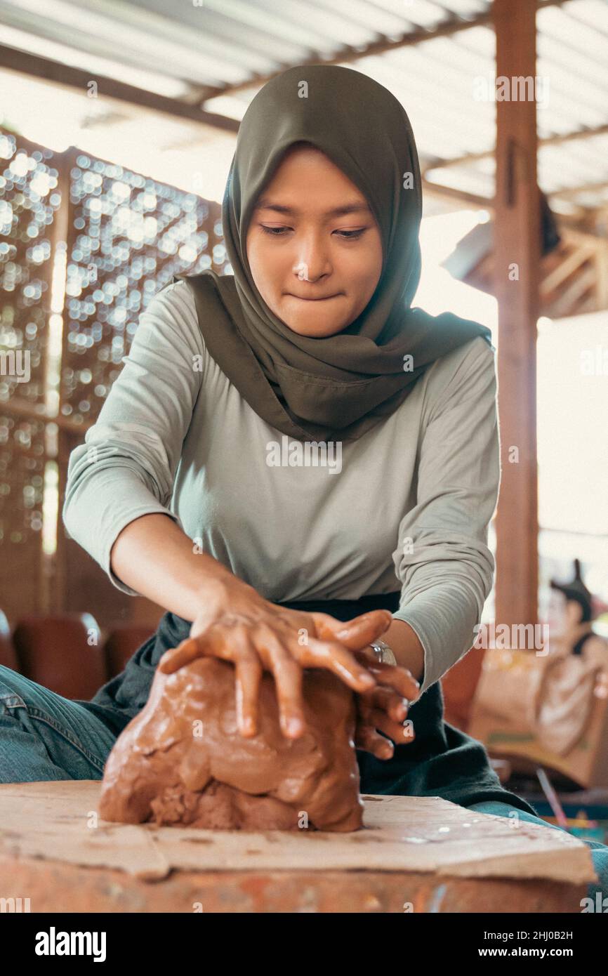 Serious woman in hijab holding hi-res stock photography and images - Alamy