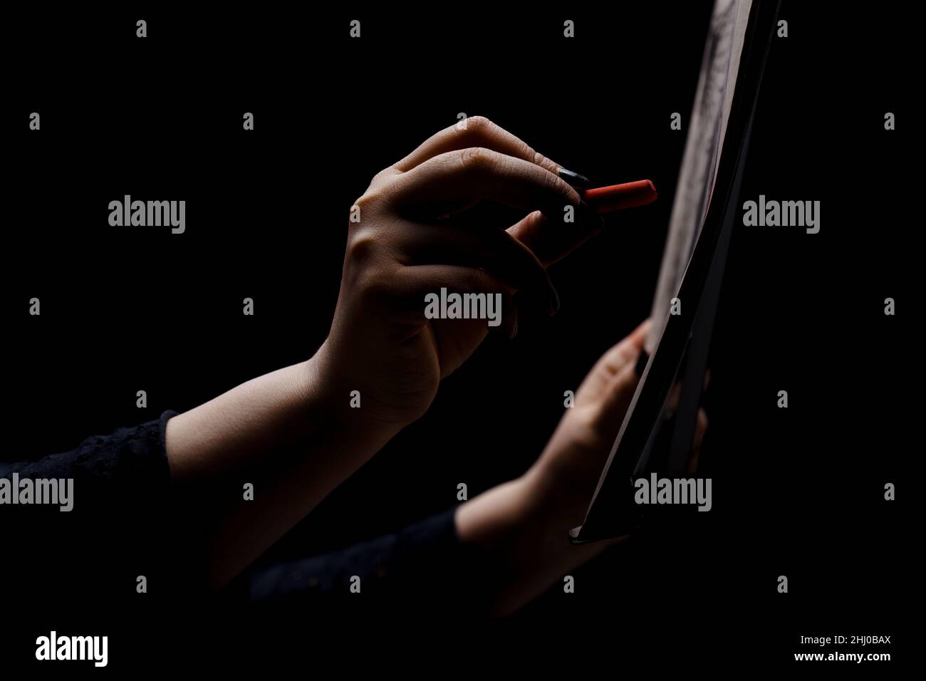 Artist drawing with chalk. Abstract hand painting on paper against ...