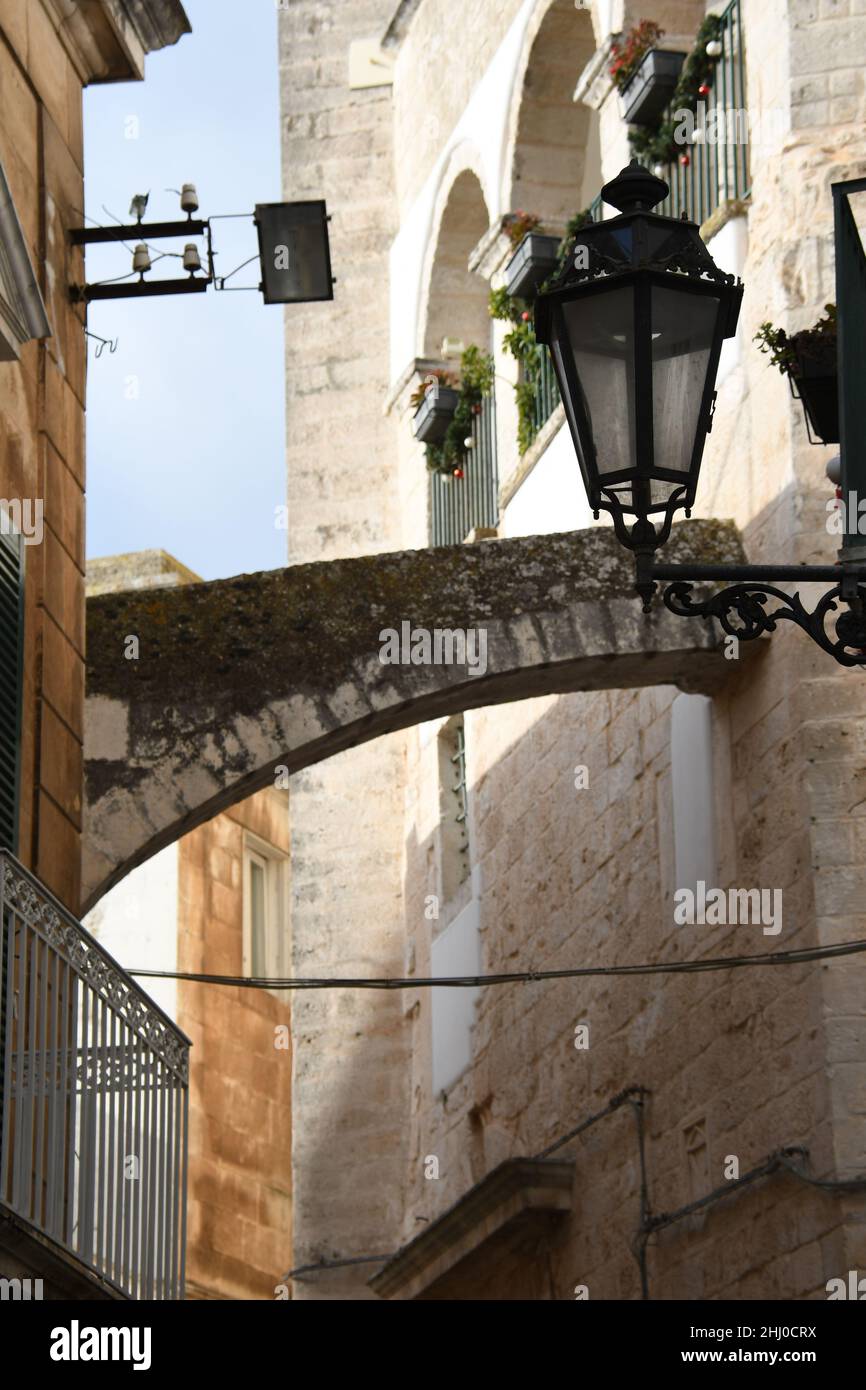 A stone arc inside the old town of Ostuni, also known as "The white ...