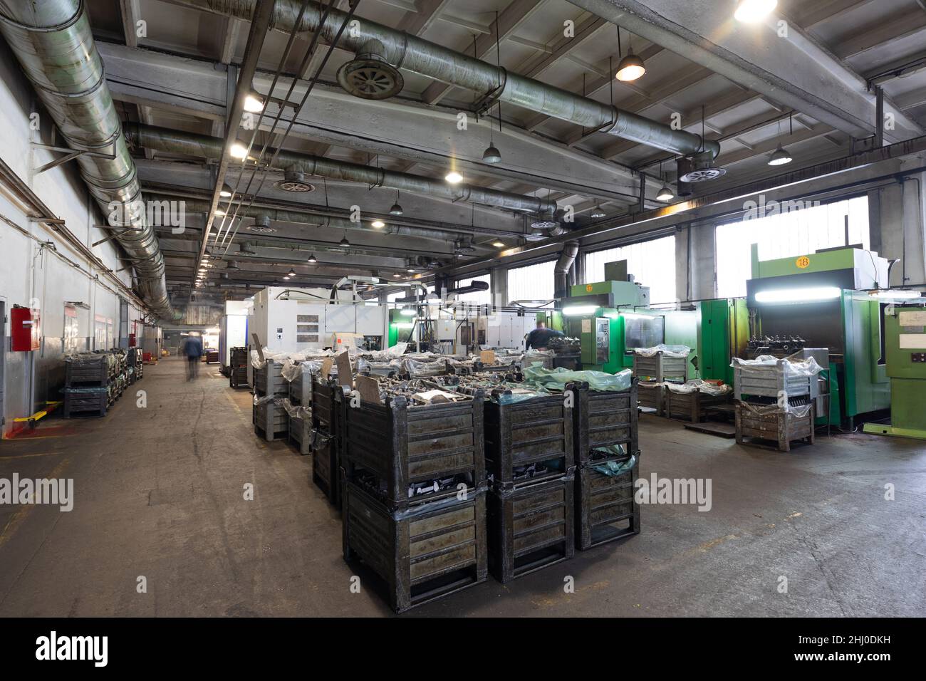 The interior of a big industrial building of factory with steel ...