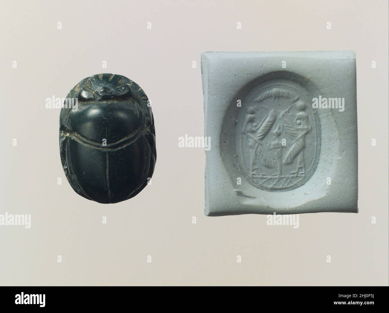 Scarab seal and modern impression: Osiris flanked by protective deities ...