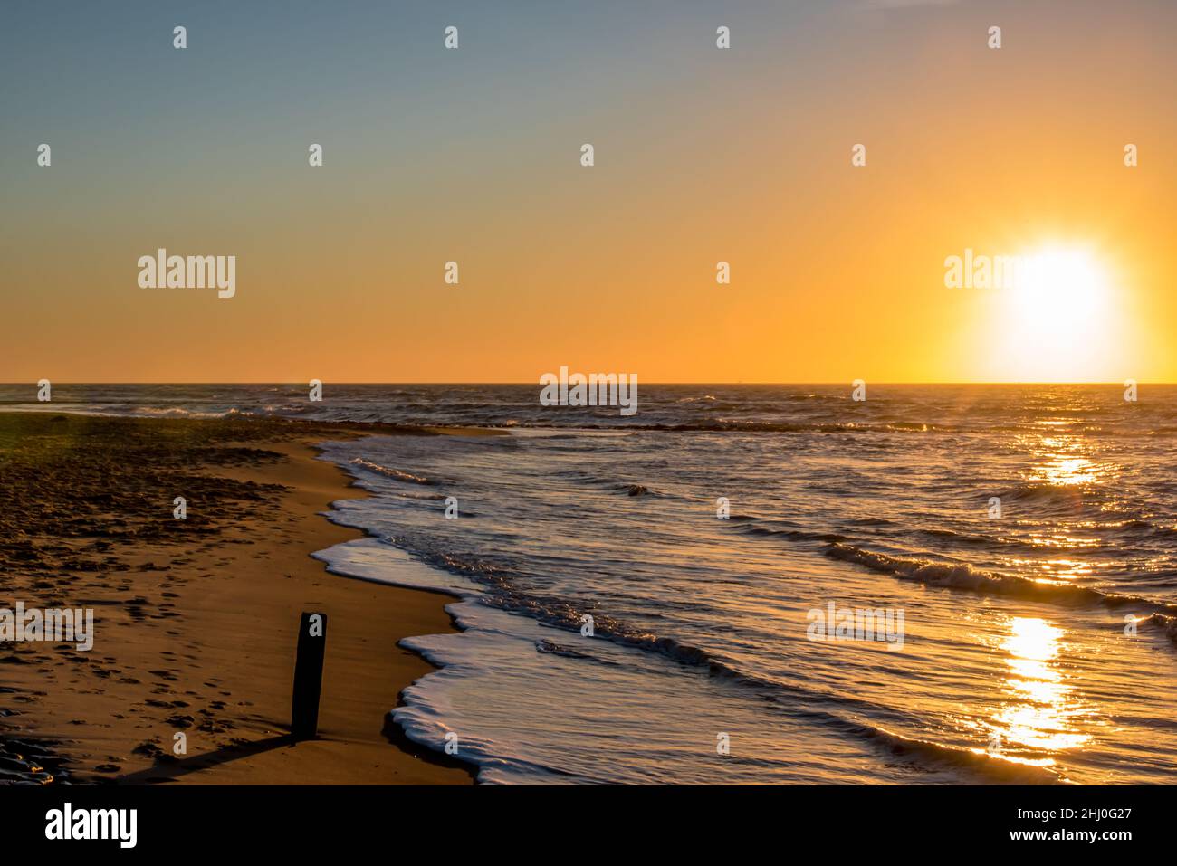 Den Helder, Netherlands. January 2022. Setting sun on the beach of Den ...