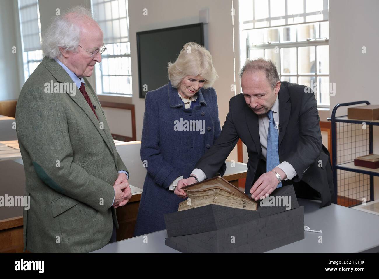 The Duchess of Cornwall and author Philip Pullman (left) are shown a ...