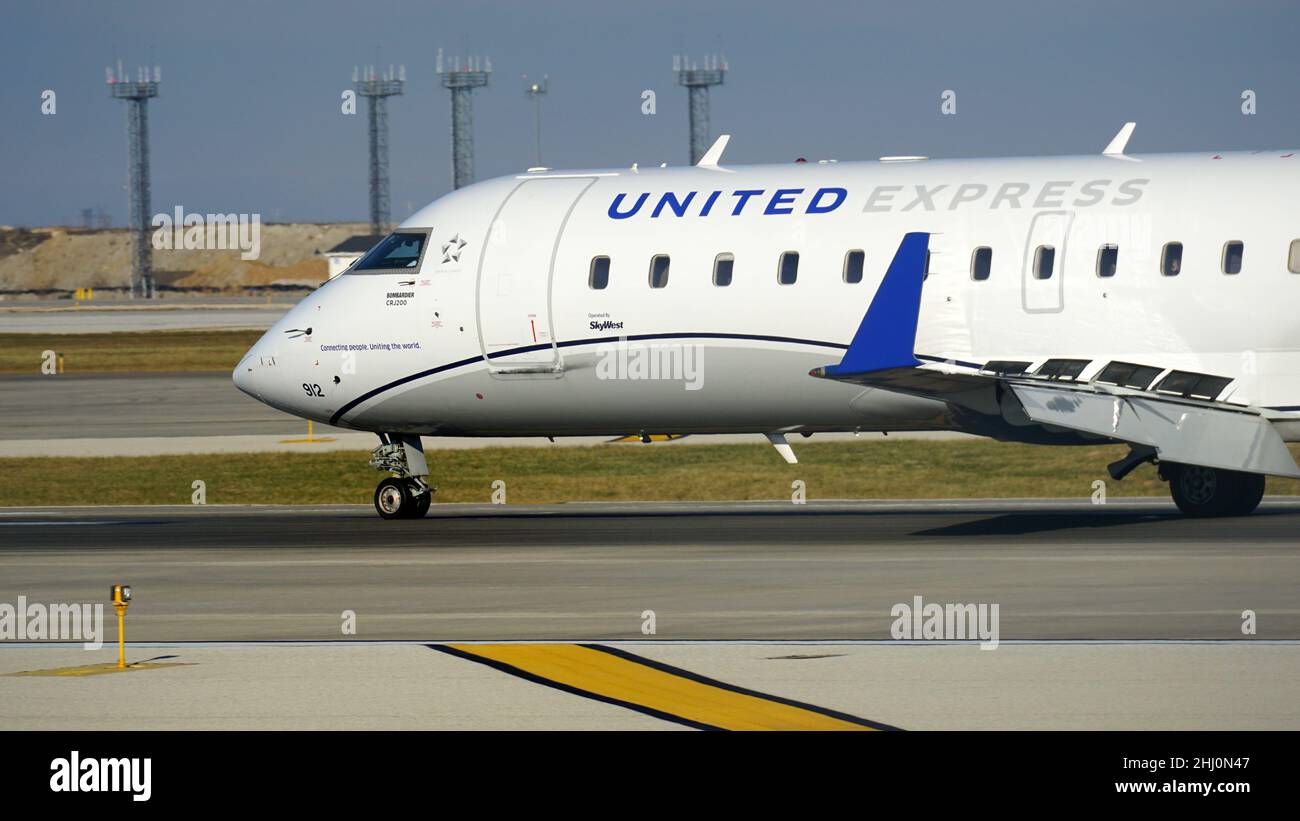 United Airlines Express Embraer E175 regional jet taxies on the runway ...