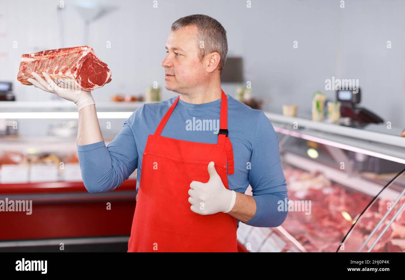 Man selling beef hi-res stock photography and images - Alamy