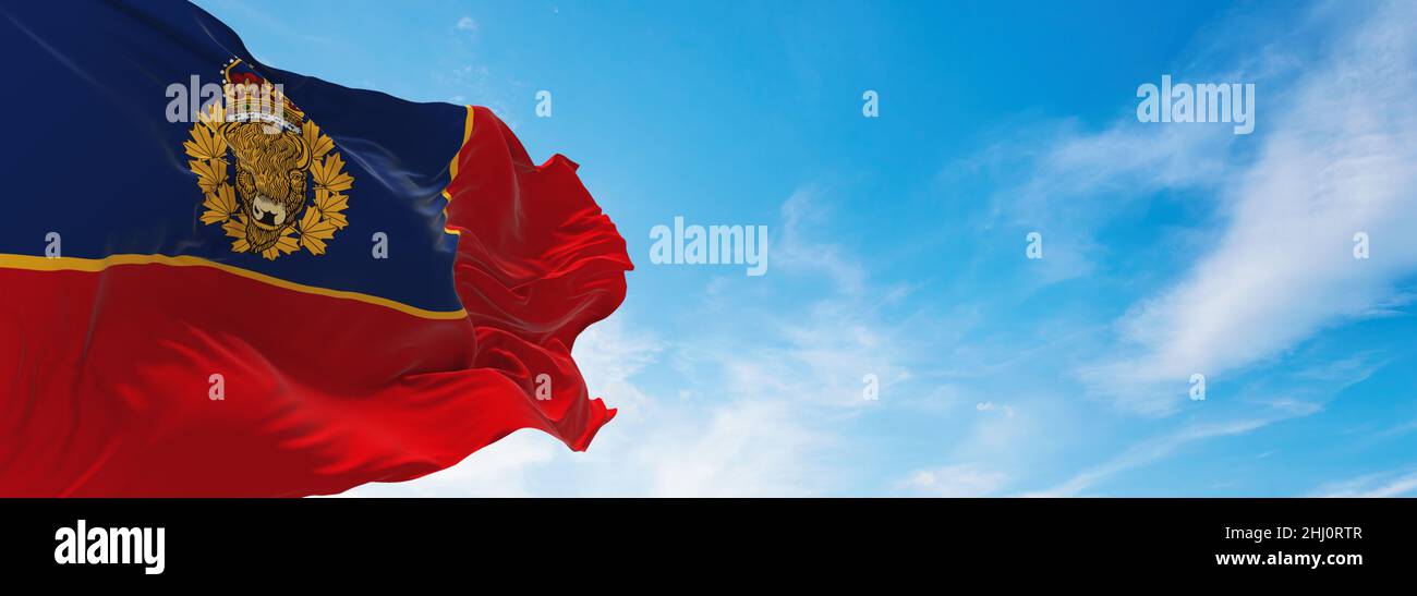 flag of Royal Canadian Mounted Police , Canada at cloudy sky background ...