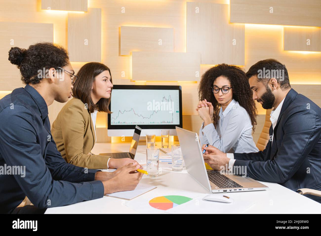 Young coworkers. Young modern woman in smart casual wear working with ...