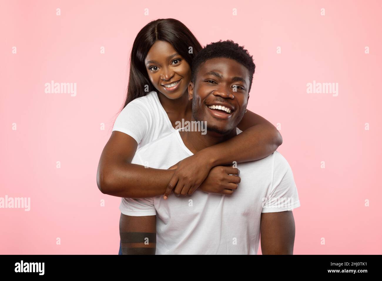 African American lady cuddling with her man Stock Photo - Alamy