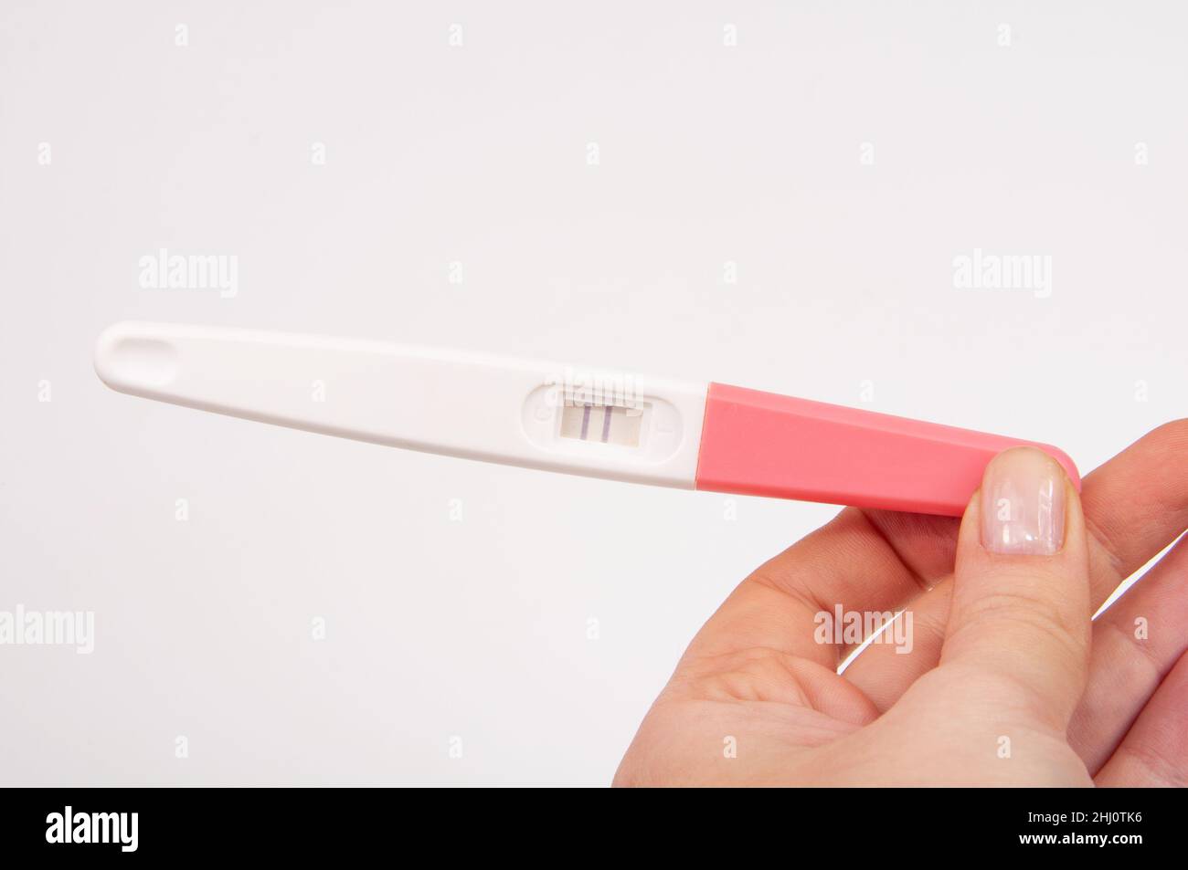 Pregnancy test positive with two lines on the white Stock Photo - Alamy