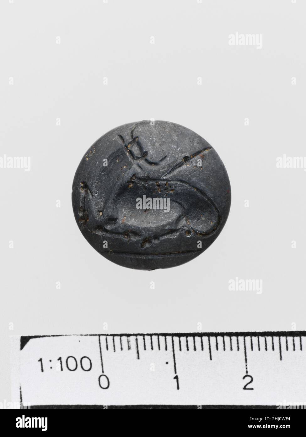 Haematite lentoid seal ca. 1450–1400 B.C. Minoan Wounded bull ...