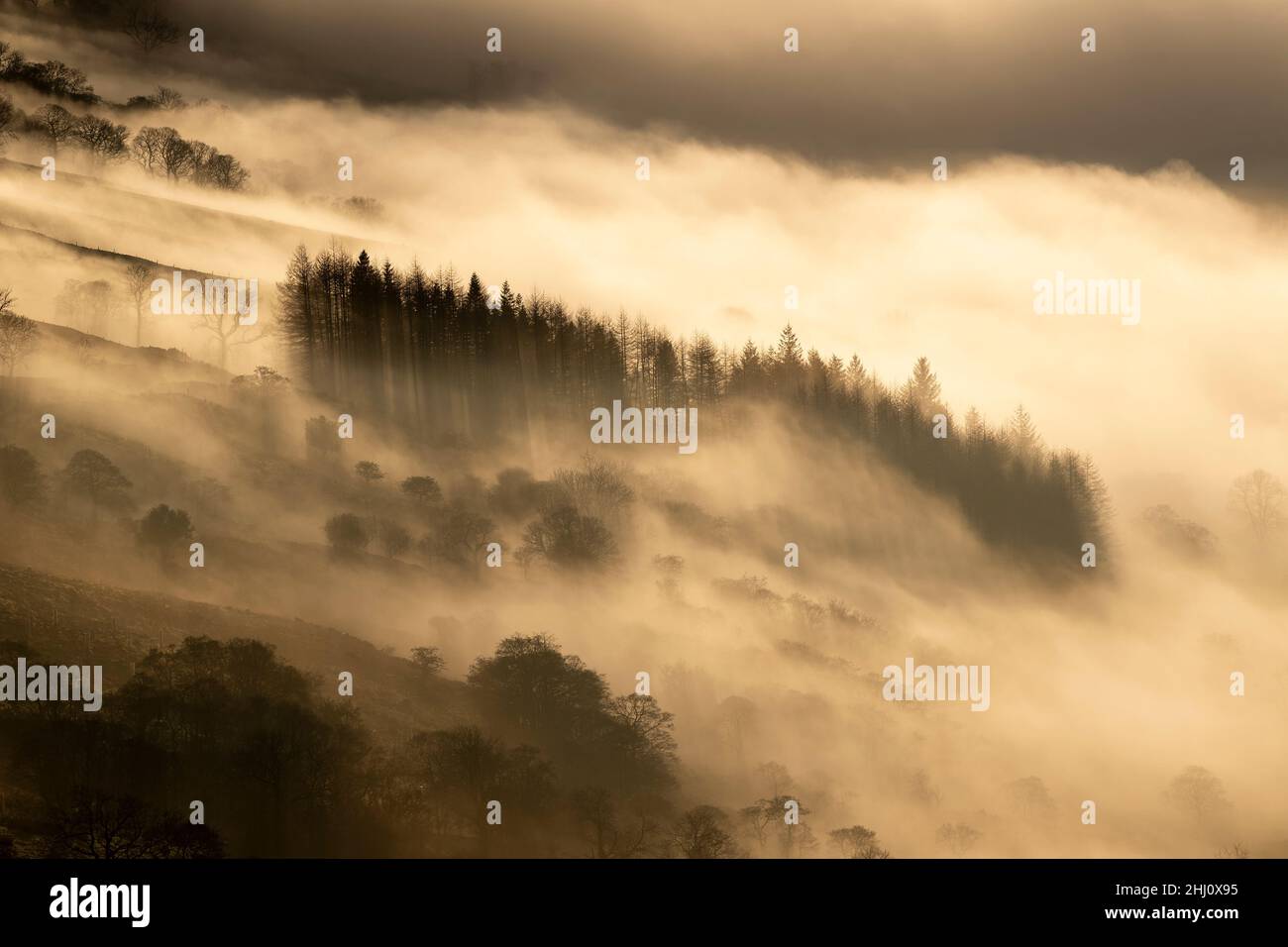 Atmospheric scenes from Kirkstone Pass looking over Windermere, as a ...