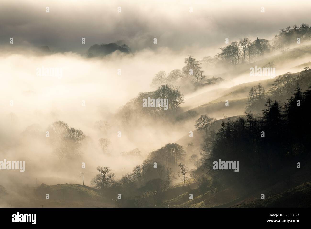 Atmospheric scenes from Kirkstone Pass looking over Windermere, as a ...
