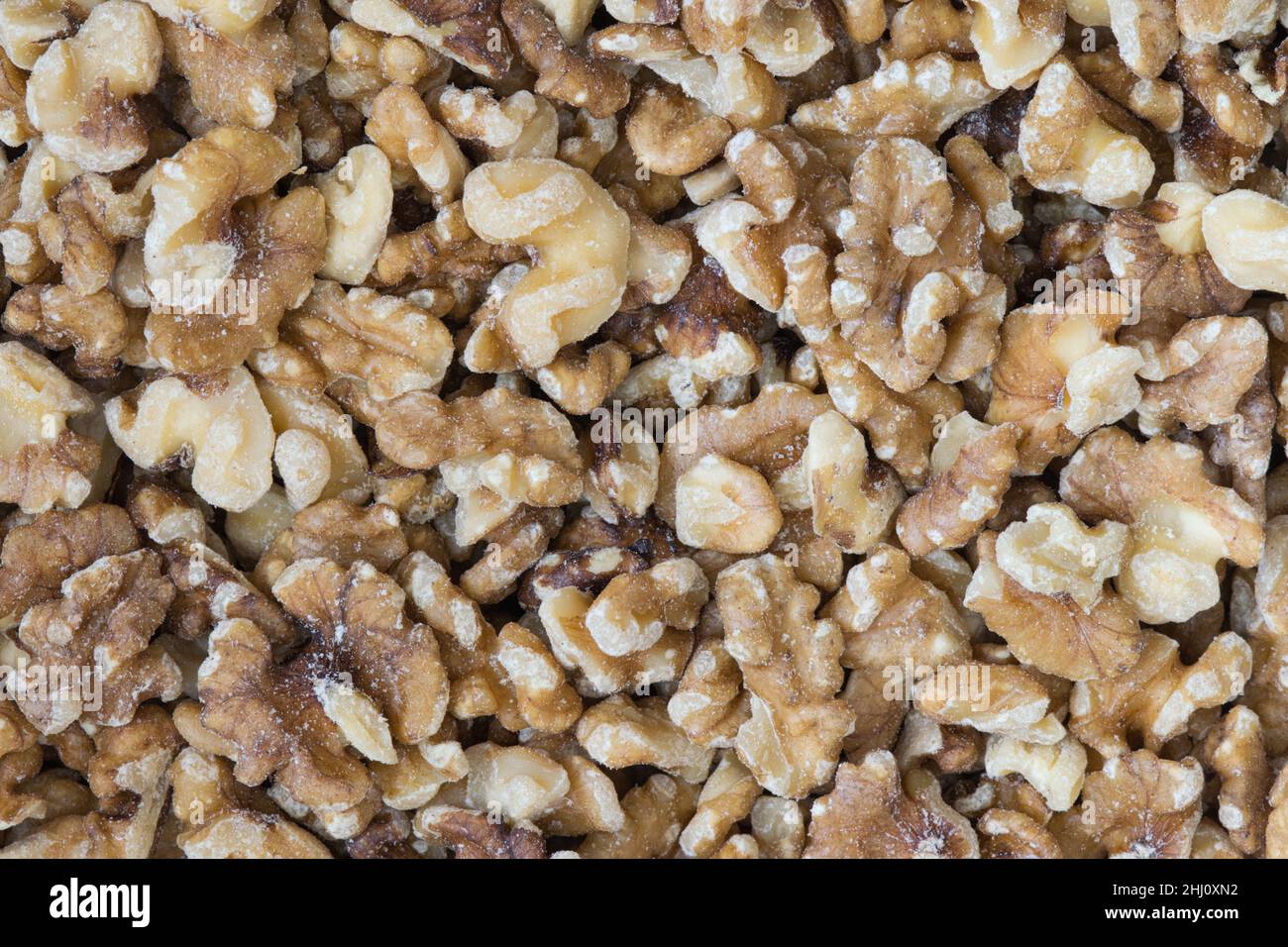 Walnut pieces, shapes and textures closeup background image. Popular ...
