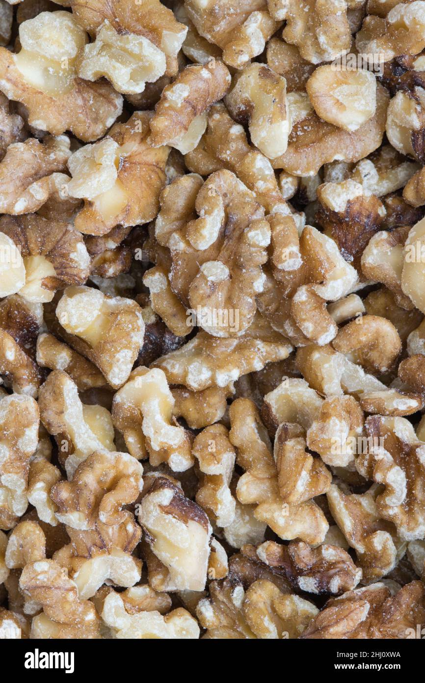 Walnut pieces, shapes and textures closeup background image. Popular ...